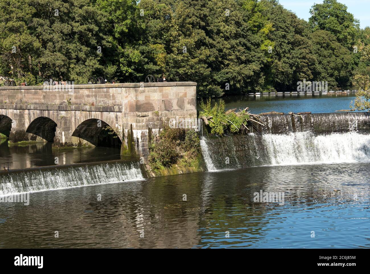 Old stone arched river weir bridge Stock Photo - Alamy
