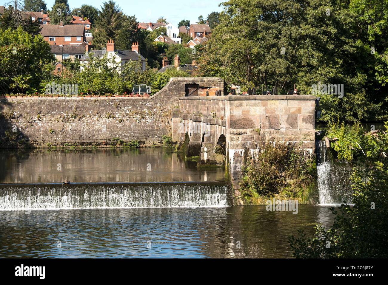 Old stone arched river weir bridge Stock Photo - Alamy