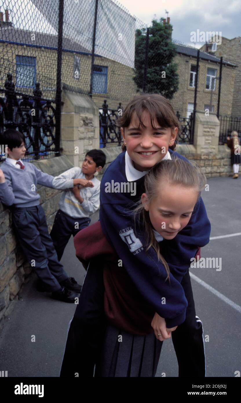 Schoolgirls playing in primary school playground; UK Stock Photo - Alamy
