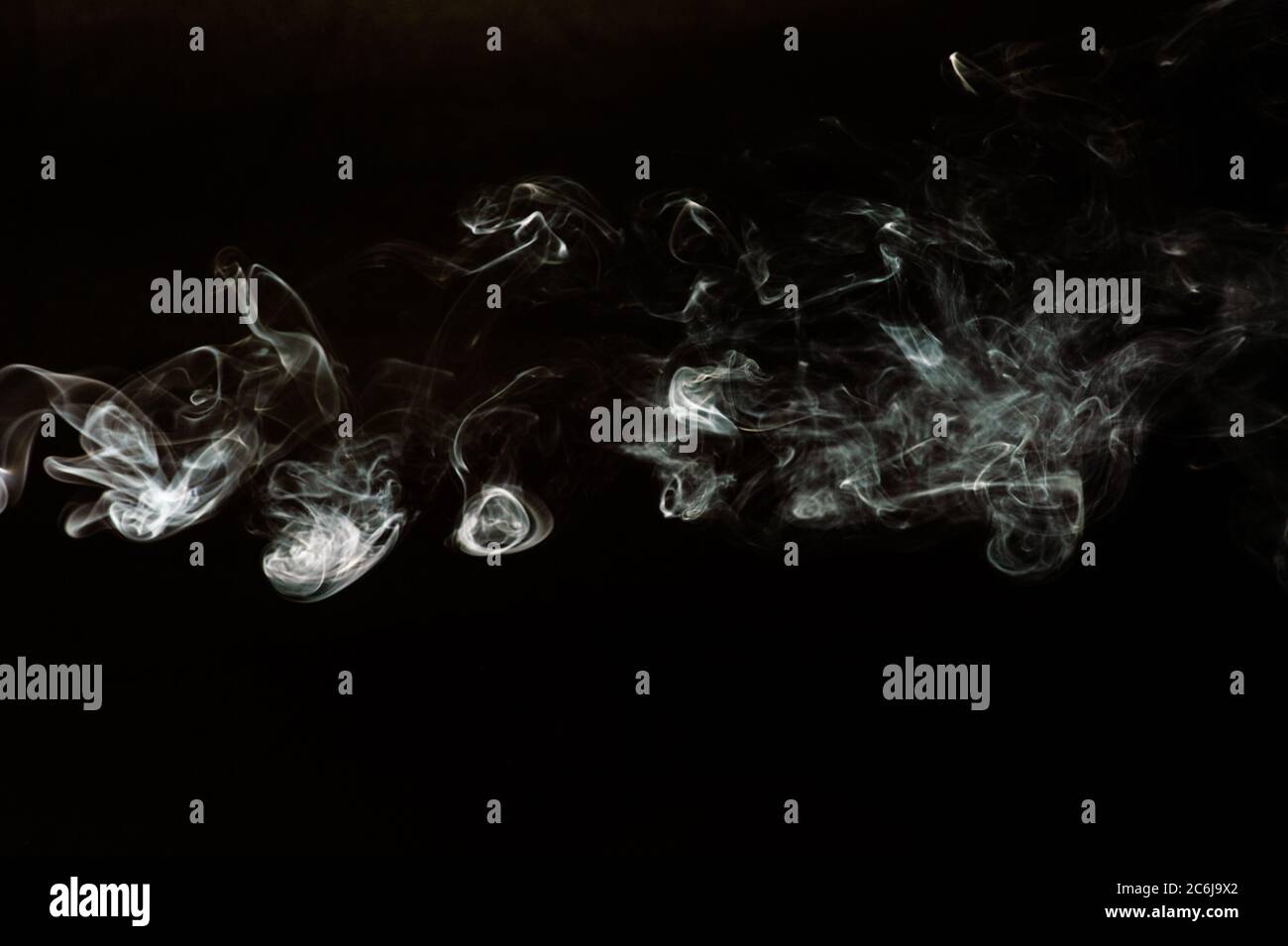 Smoke isolated on dark background Stock Photo - Alamy