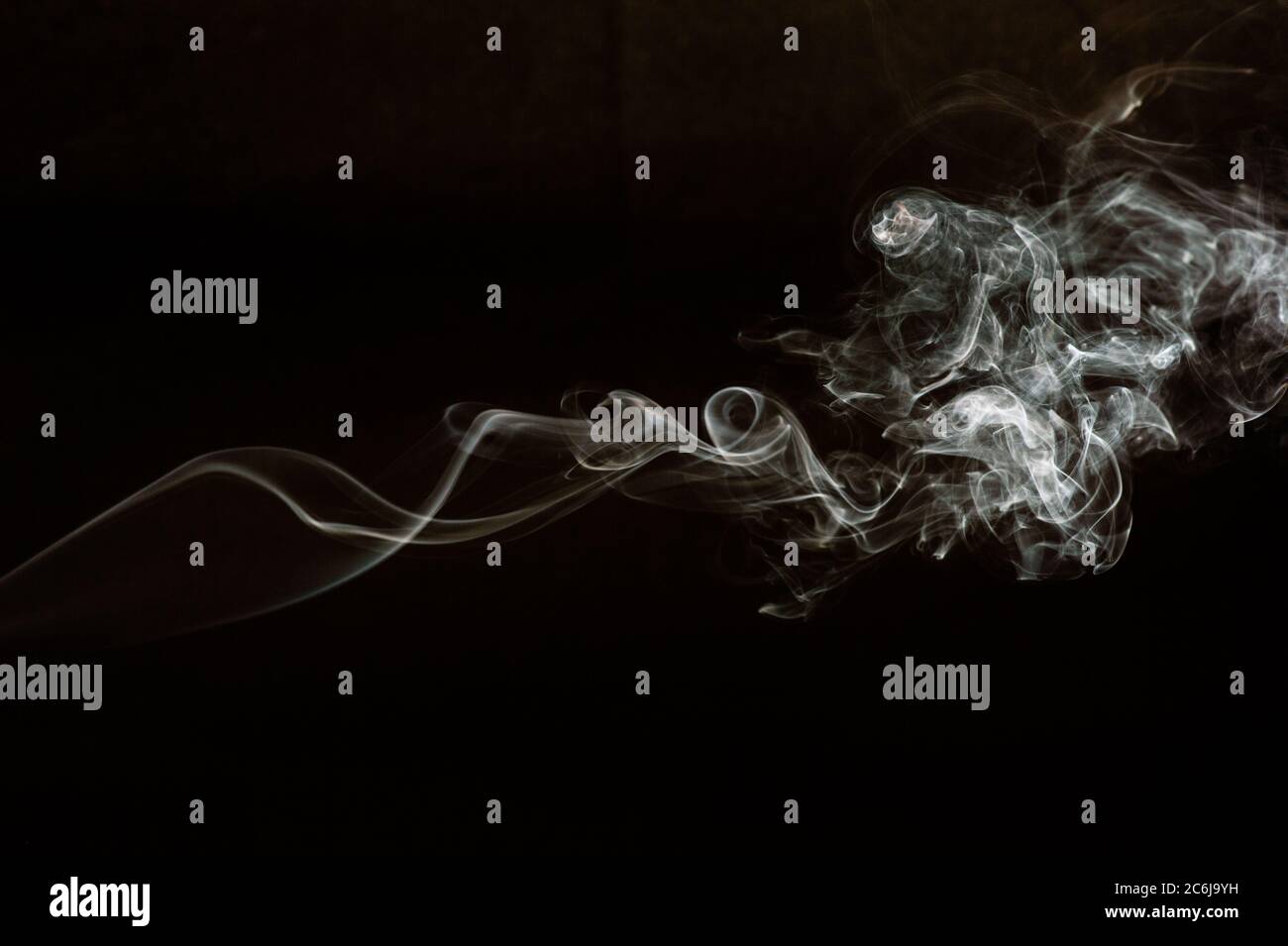 Smoke isolated on dark background Stock Photo - Alamy