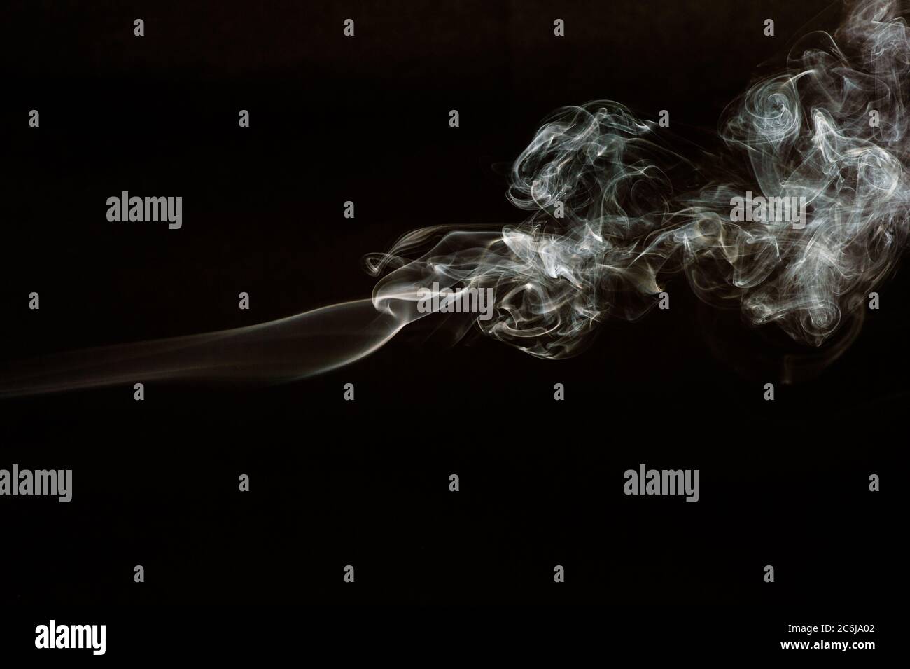 Smoke isolated on dark background Stock Photo - Alamy