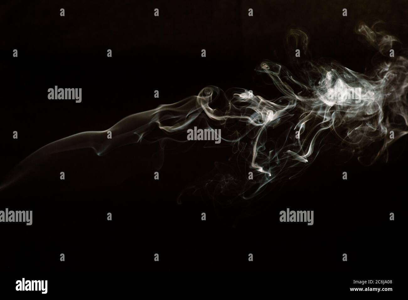 Smoke isolated on dark background Stock Photo - Alamy