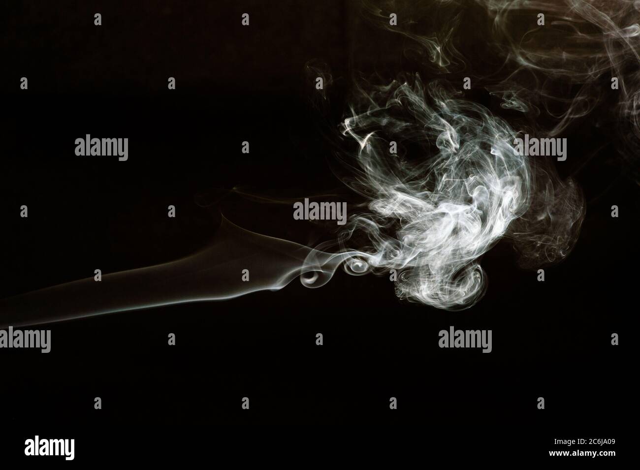 Smoke isolated on dark background Stock Photo - Alamy