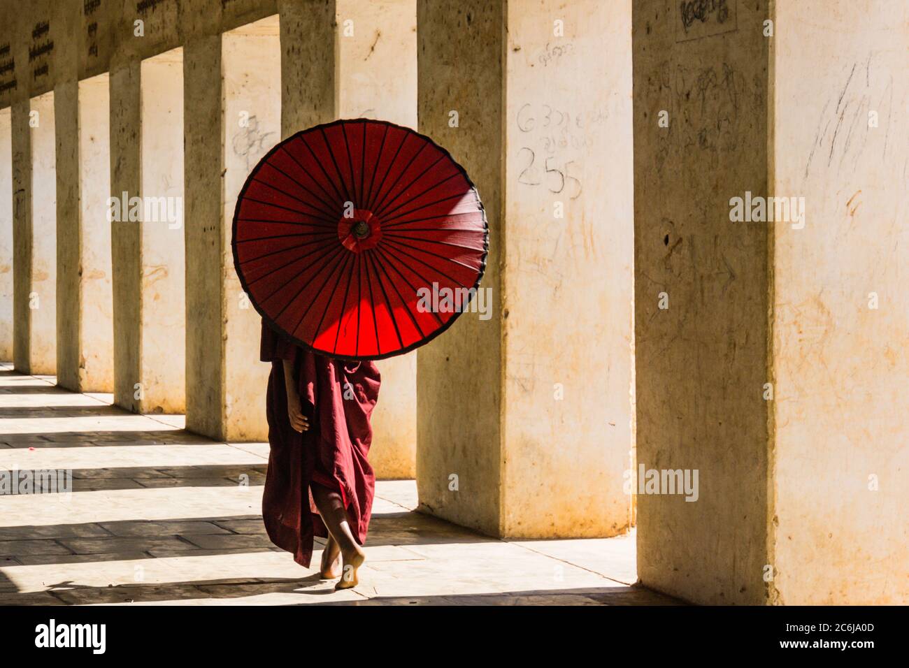 Bagan,Mandalay/ Myanmar- 01/20/2019: young novice monk walking along ... Bagan,Mandalay/ Myanmar- 01/20/2019: young novice monk walking along ...