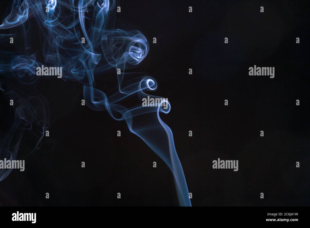 Smoke isolated on dark background Stock Photo - Alamy