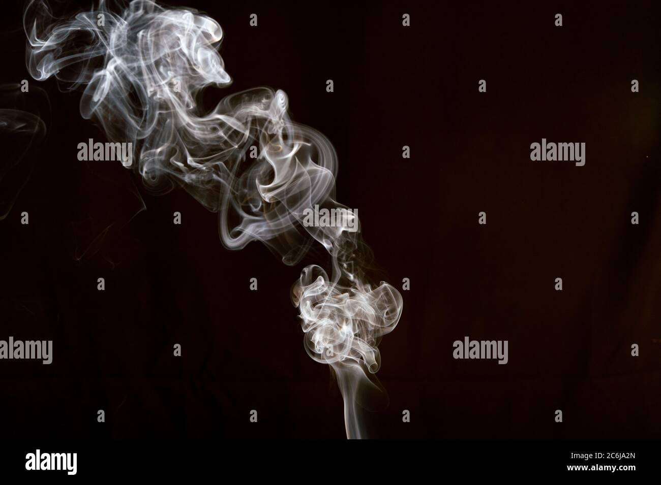 Smoke isolated on dark background Stock Photo - Alamy