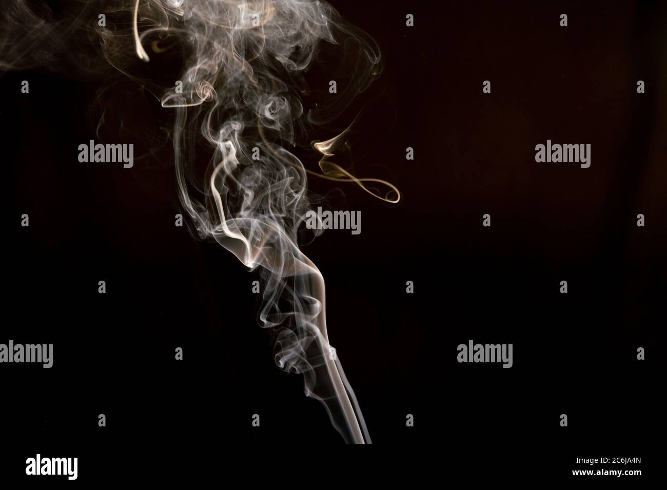 Smoke isolated on dark background Stock Photo - Alamy