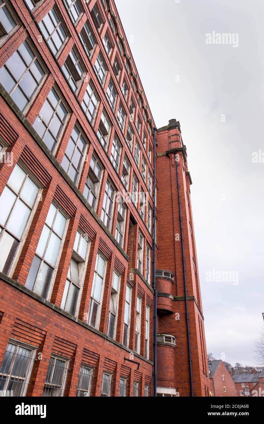 Tall old Derbyshire mill building Stock Photo - Alamy