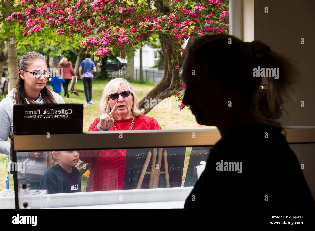 Customers ordering ice cream from a cafe Stock Photo - Alamy