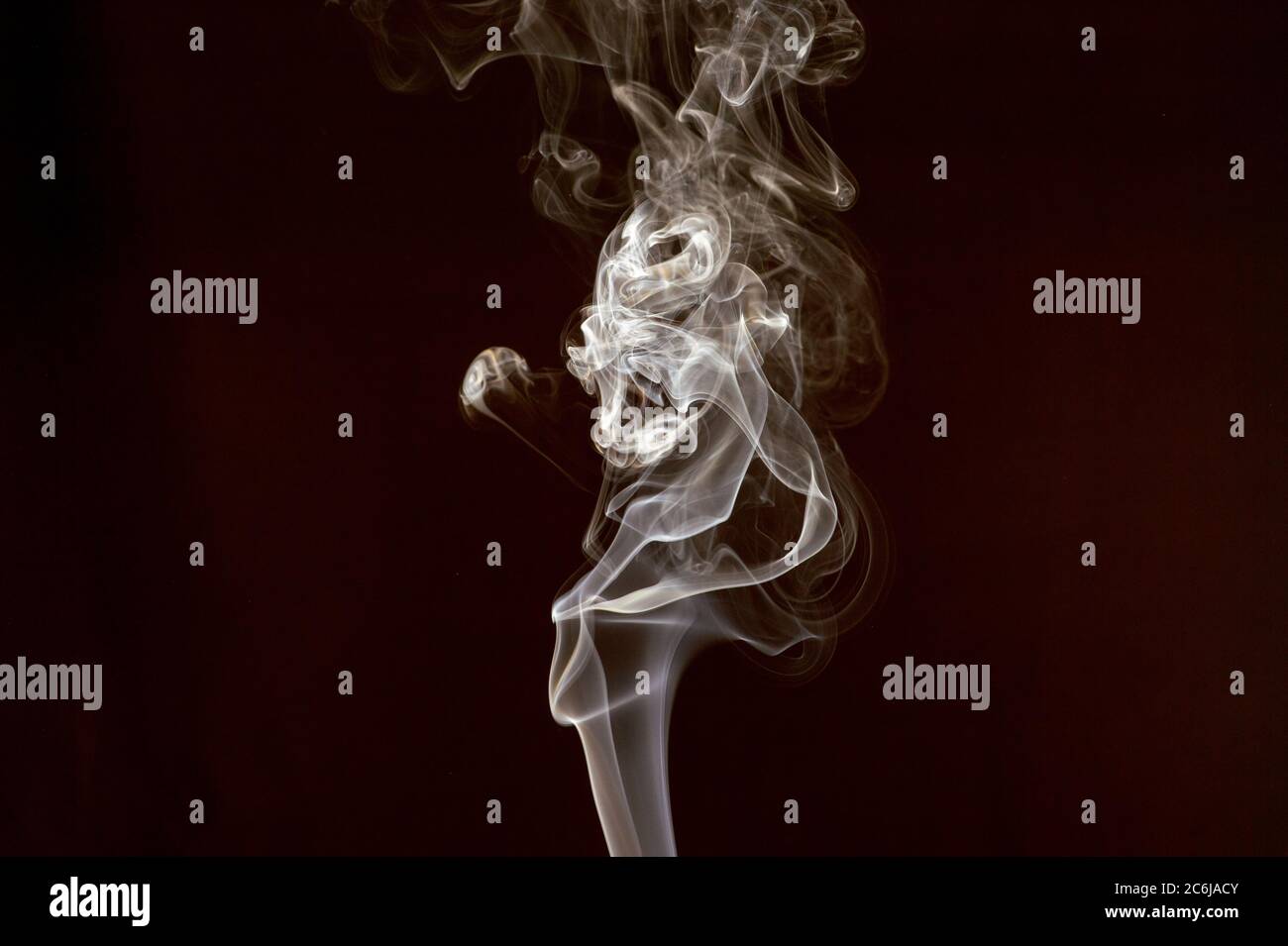 Smoke isolated on dark background Stock Photo - Alamy