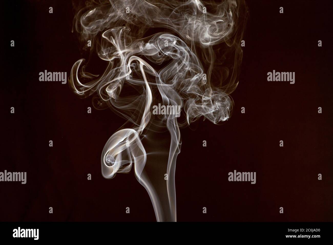 Smoke isolated on dark background Stock Photo - Alamy