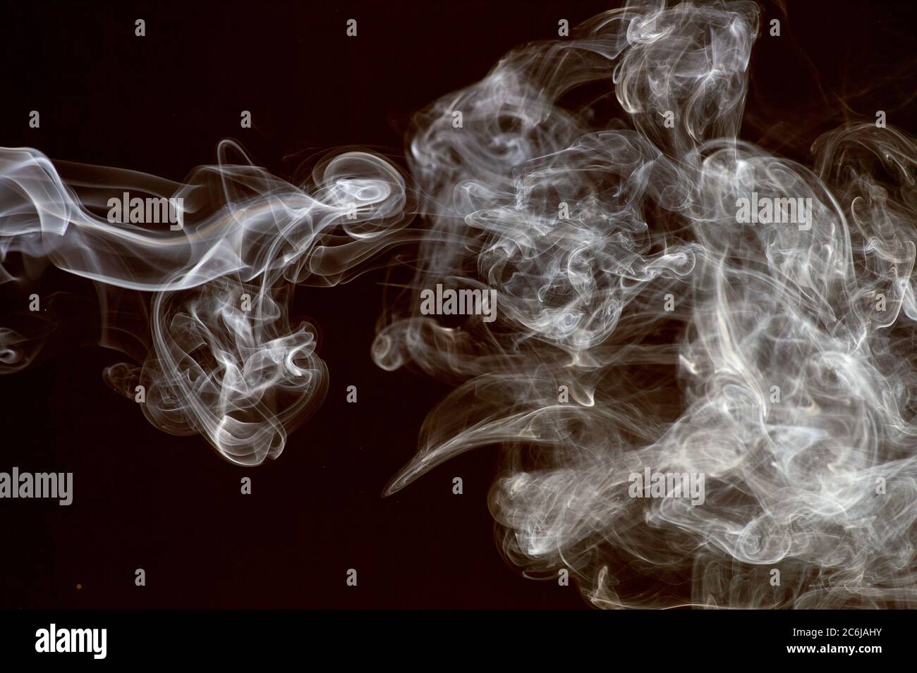 Smoke isolated on dark background Stock Photo - Alamy