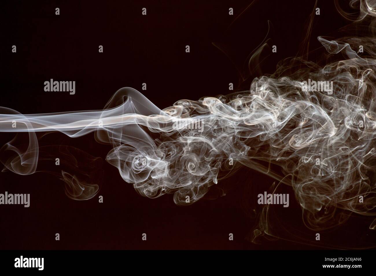 Smoke isolated on dark background Stock Photo - Alamy