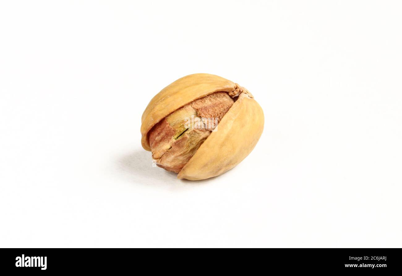 Single pistachio food in shell isolated on white background Stock Photo ...