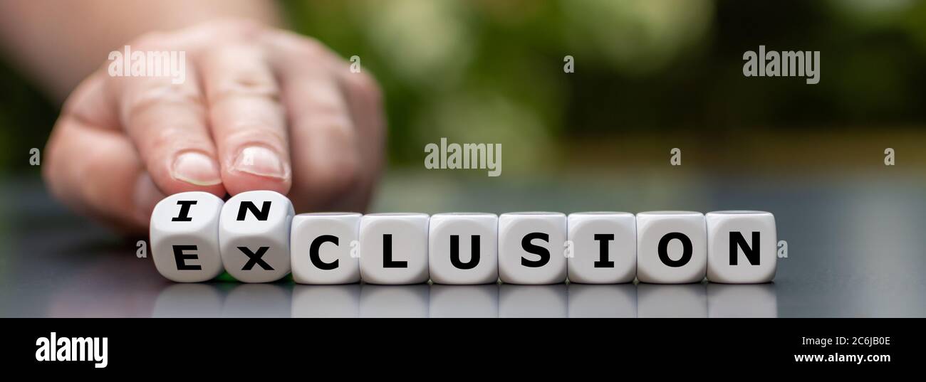 Symbol for a better inclusion. Hand turns dice and changes the word ...