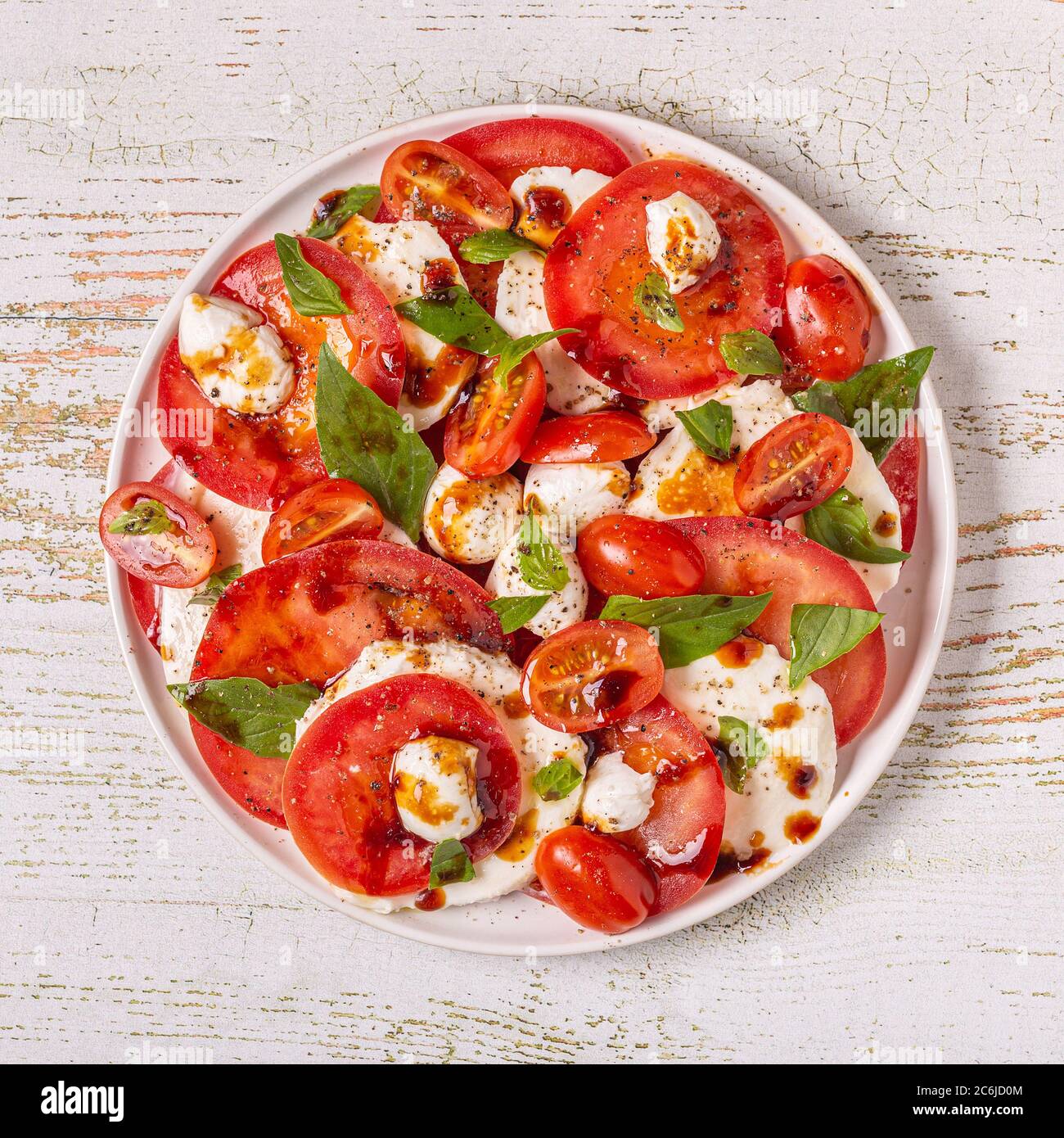 Italian caprese salad with sliced tomatoes, mozzarella cheese, basil ...