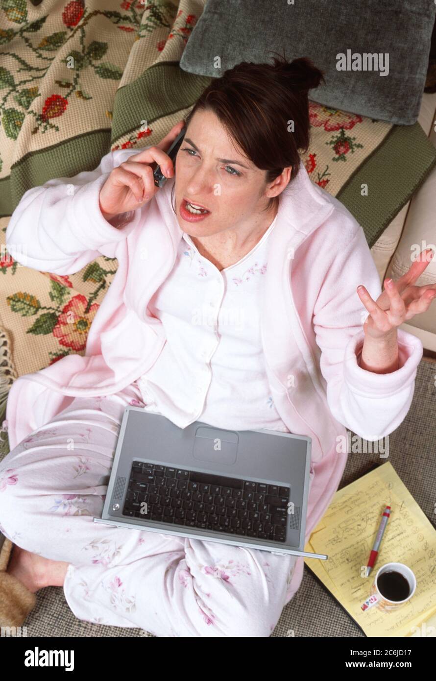 Young woman working in home office in pajamas, USA Stock Photo - Alamy