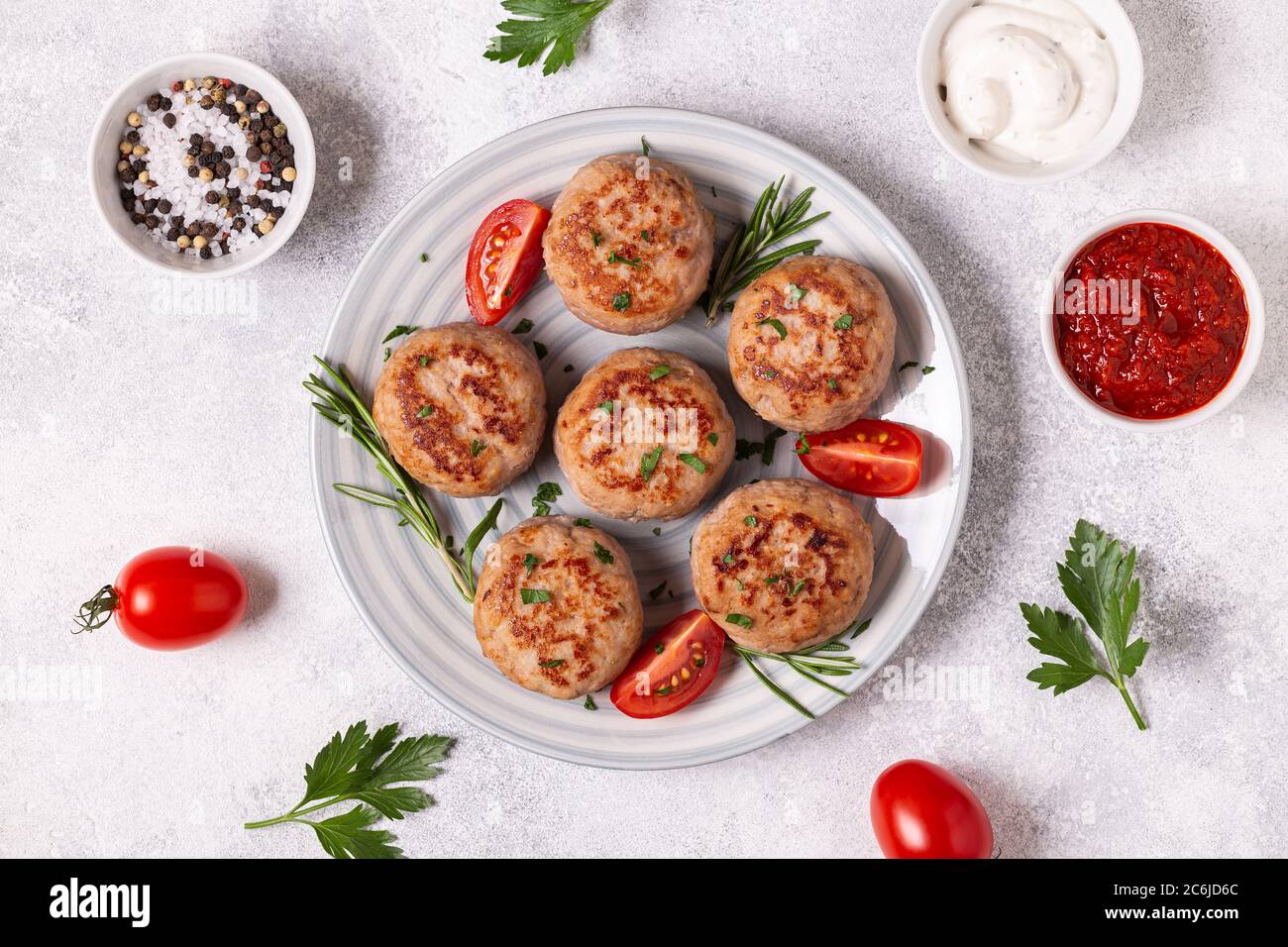 Fresh chiken cutlets with tomatoes and rosemary, top view Stock Photo ...