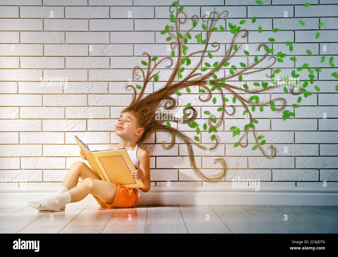 small beautiful child reading a book Stock Photo - Alamy