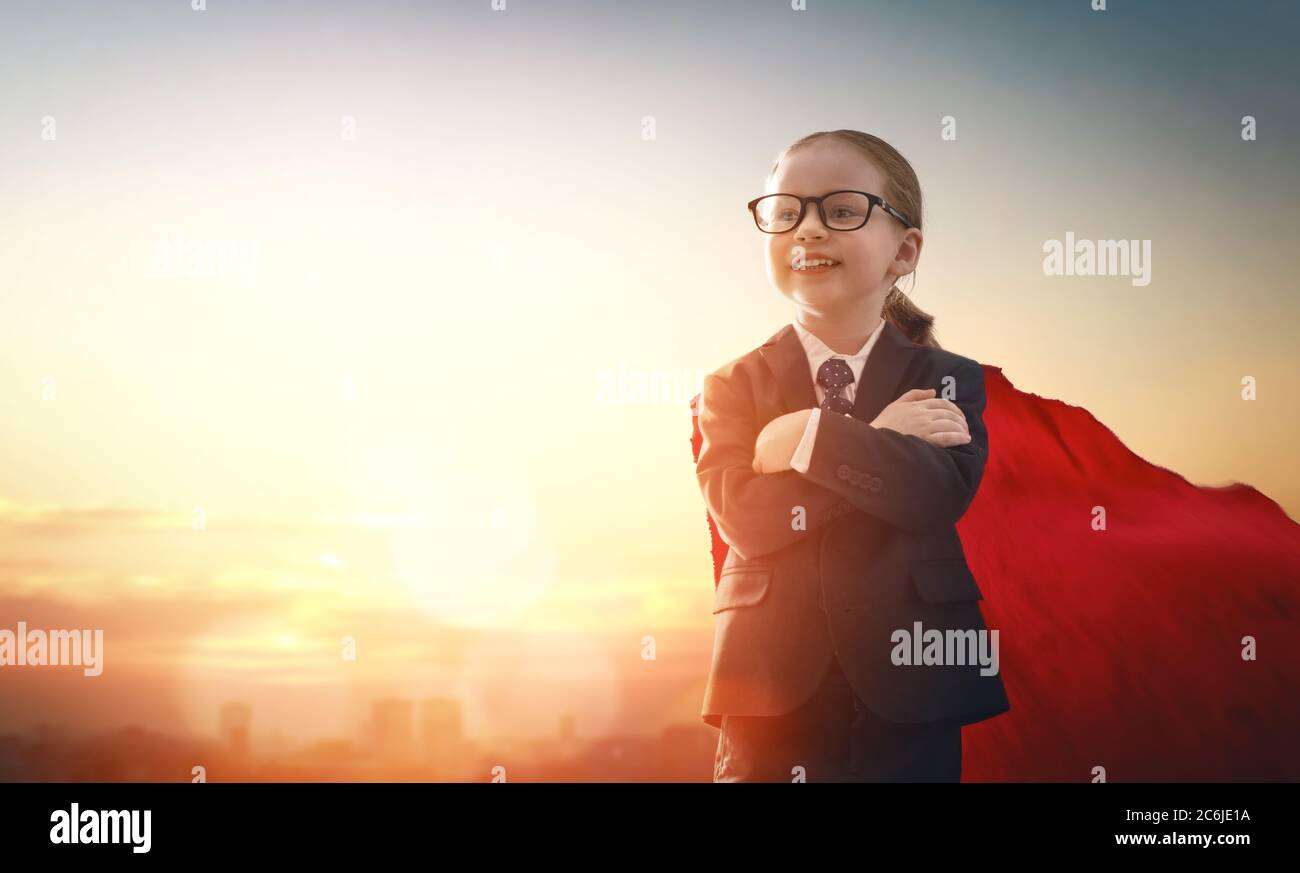superhero businessman child on sunset background. the concept of ...