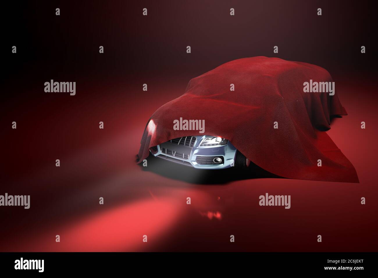 concept of presentation of the car under a red cloth in a darck red ...