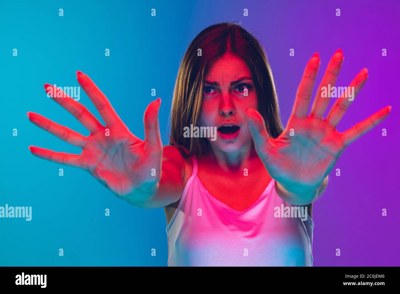 Scared, rejecting, stopping. Caucasian young woman's portrait on ...