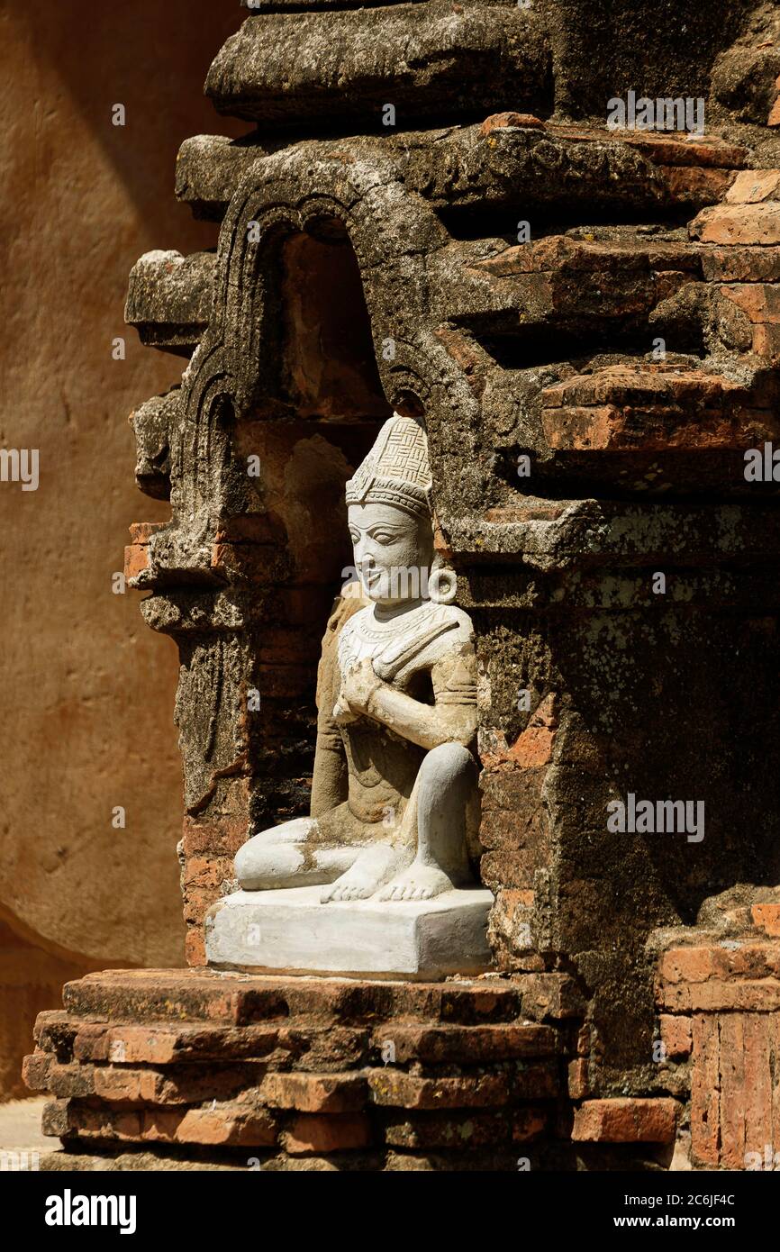 A stone sculpture from a god according to the belief of the Burmese in ...