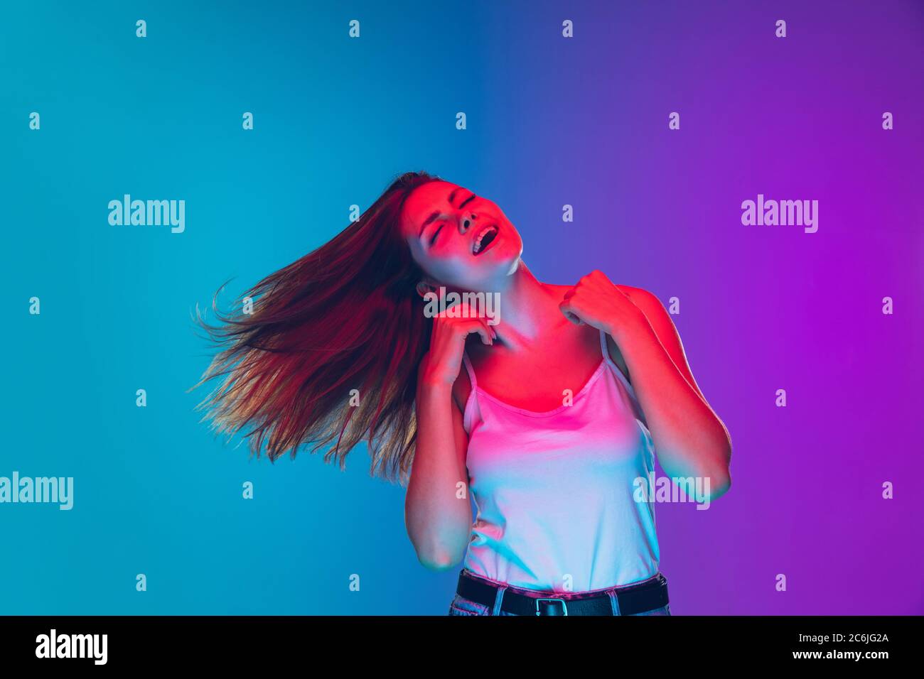 Dancing, hair blowing, inspired. Caucasian young woman's portrait on ...