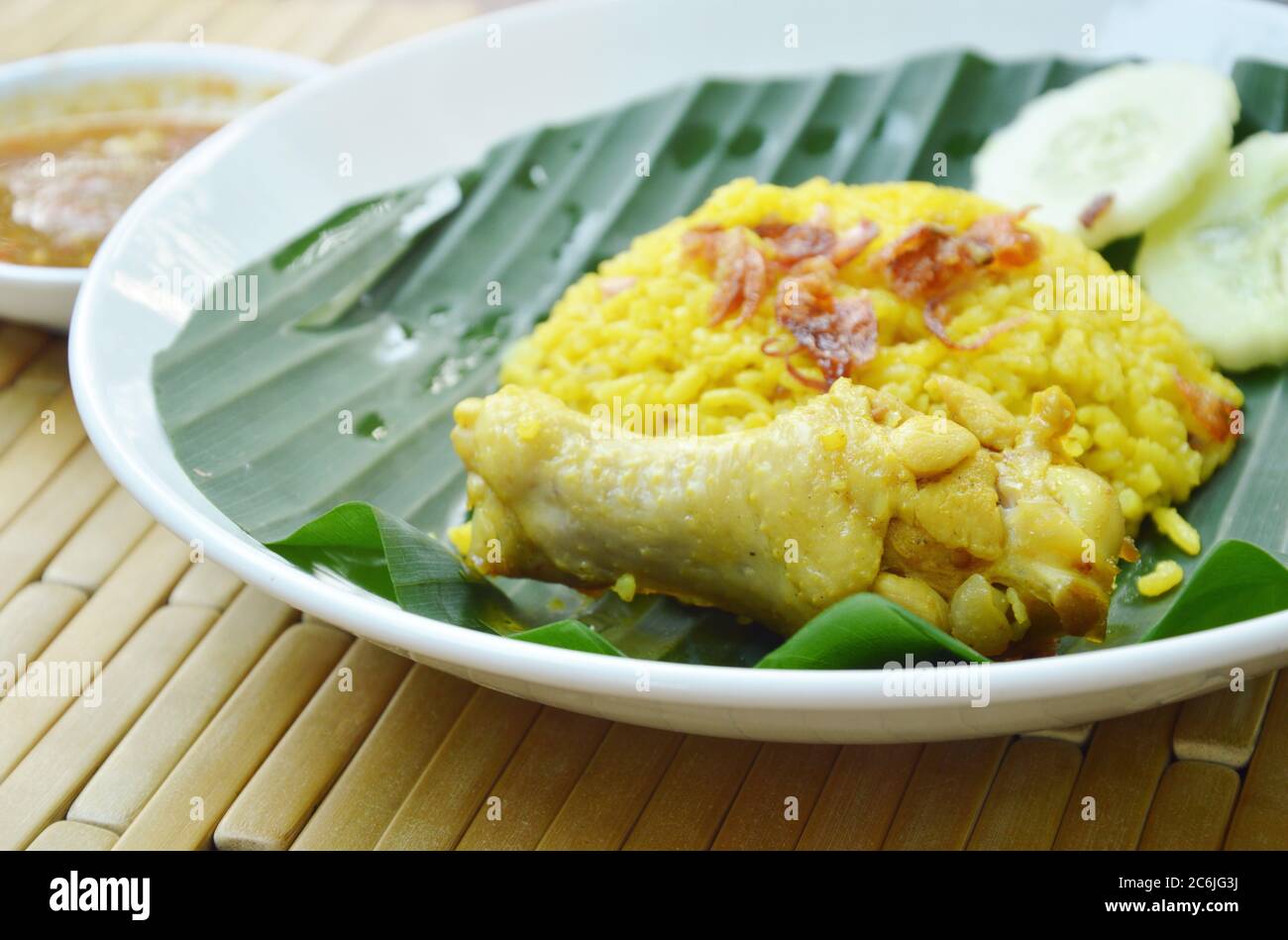 rice cooked with chicken in curry on plate and soup cup Stock Photo - Alamy