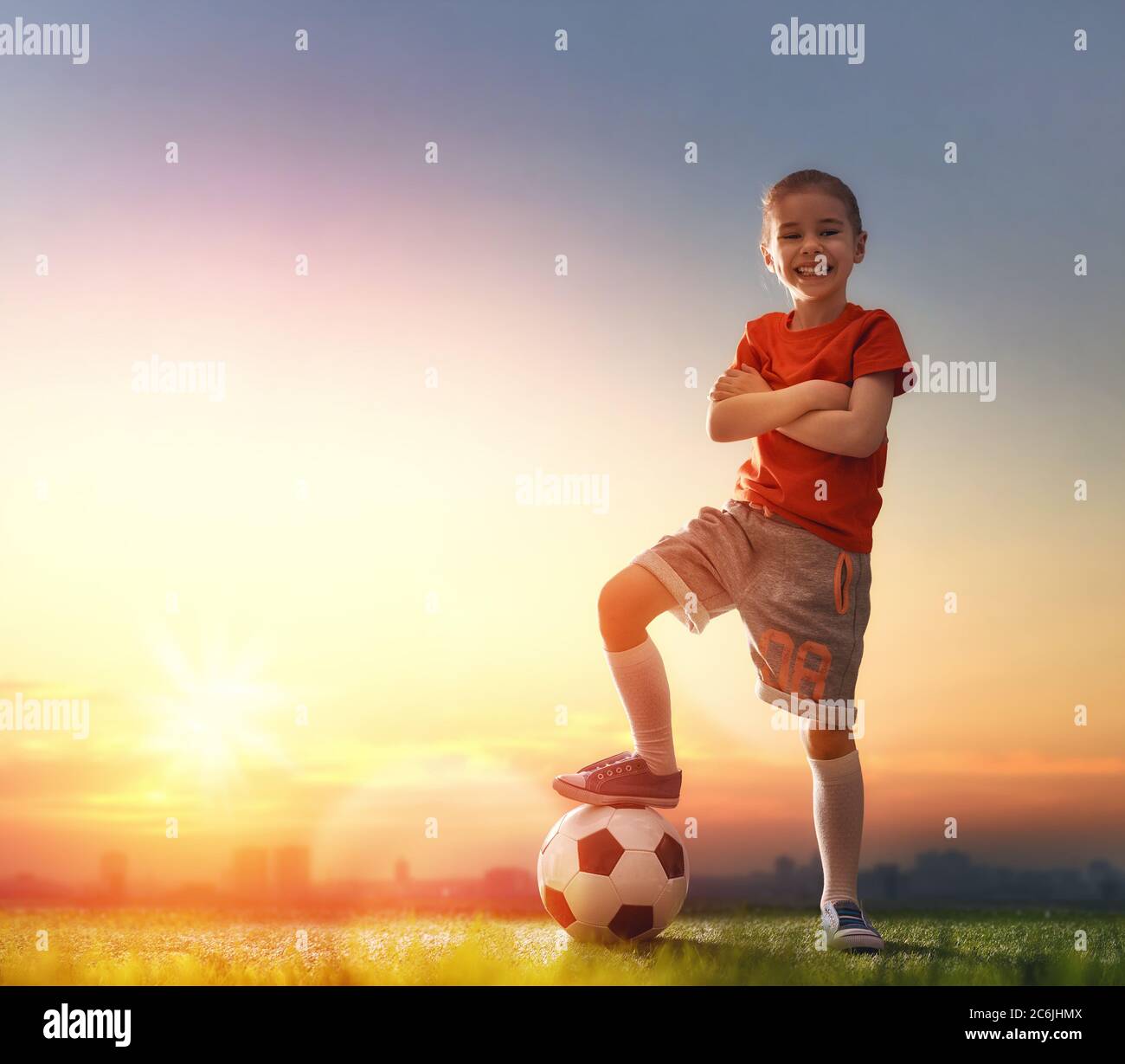 Cute little child dreams of becoming a soccer player. Child plays ...