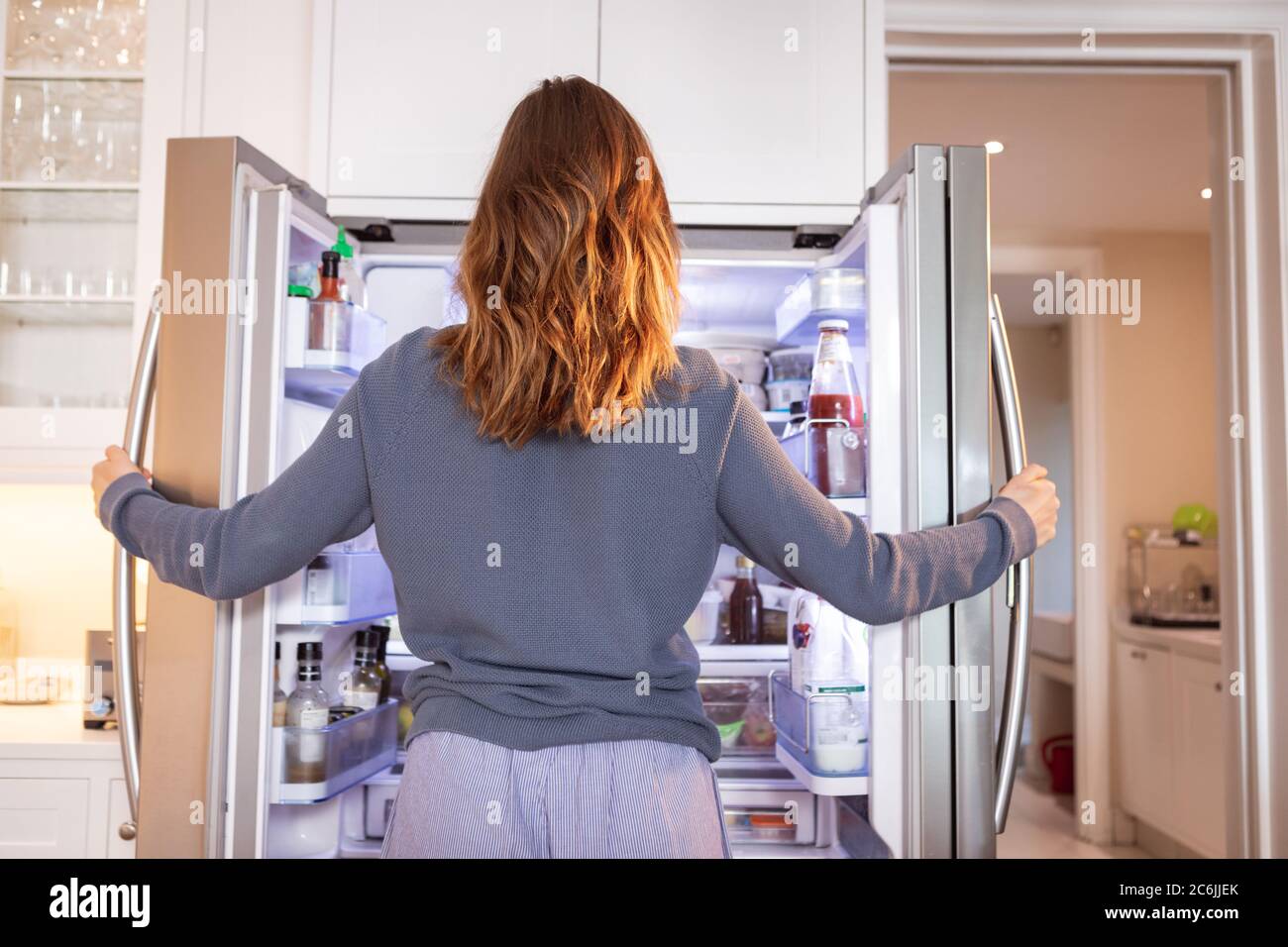 Woman Opening Fridge Home High Resolution Stock Photography and Images ...