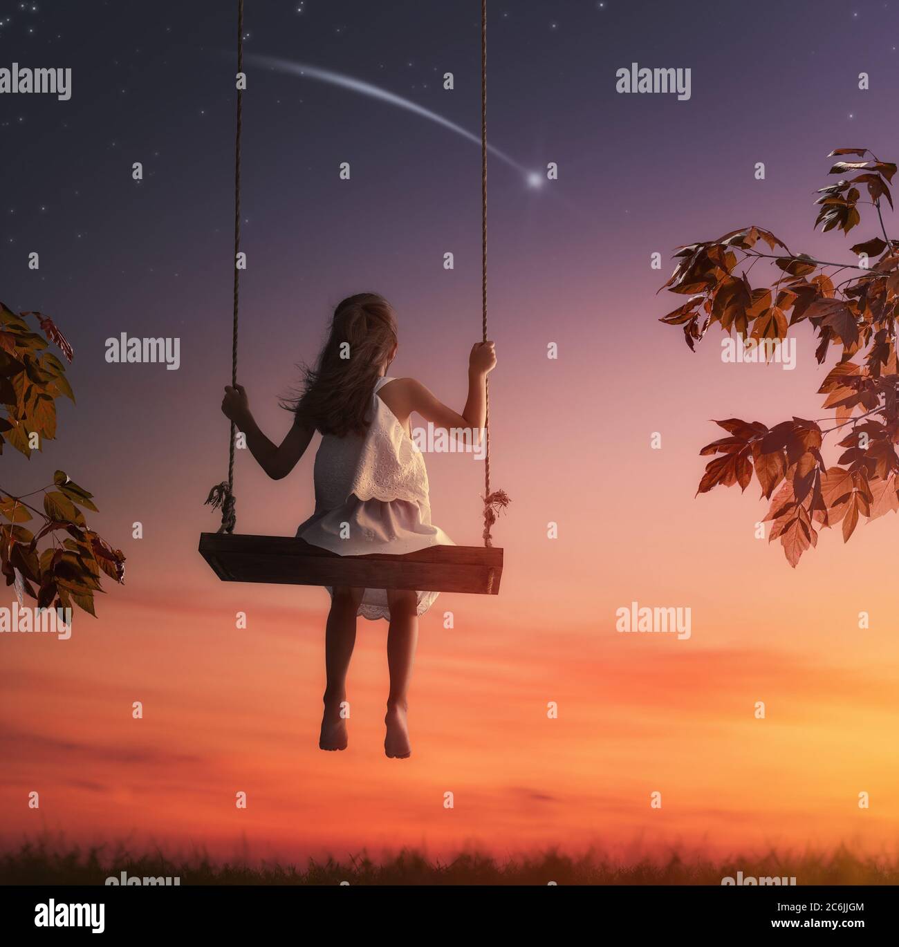 Happy child girl on swing in sunset summer. Kid makes a wish by seeing ...