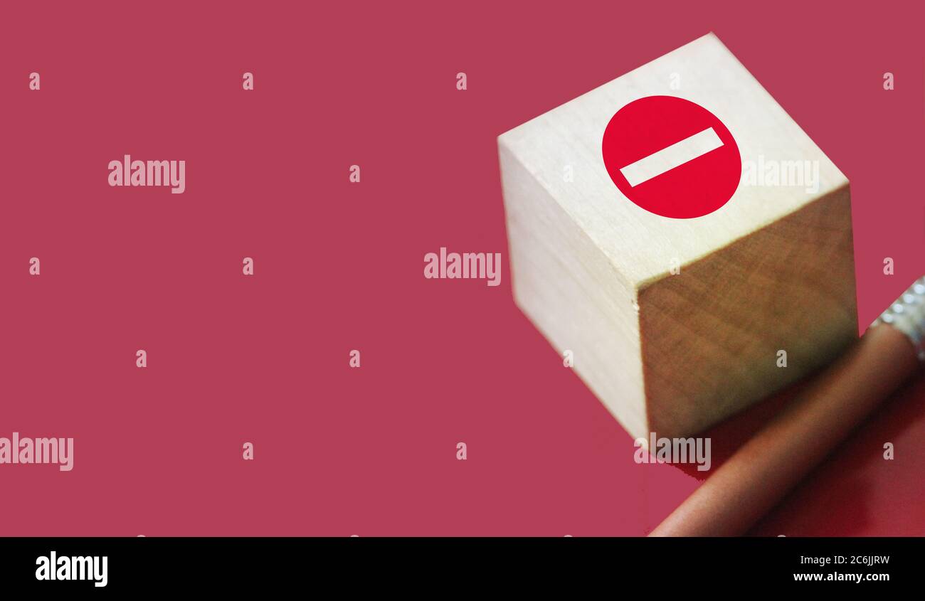 Stop sign on wooden cube on dark red background. Alert and prevention ...