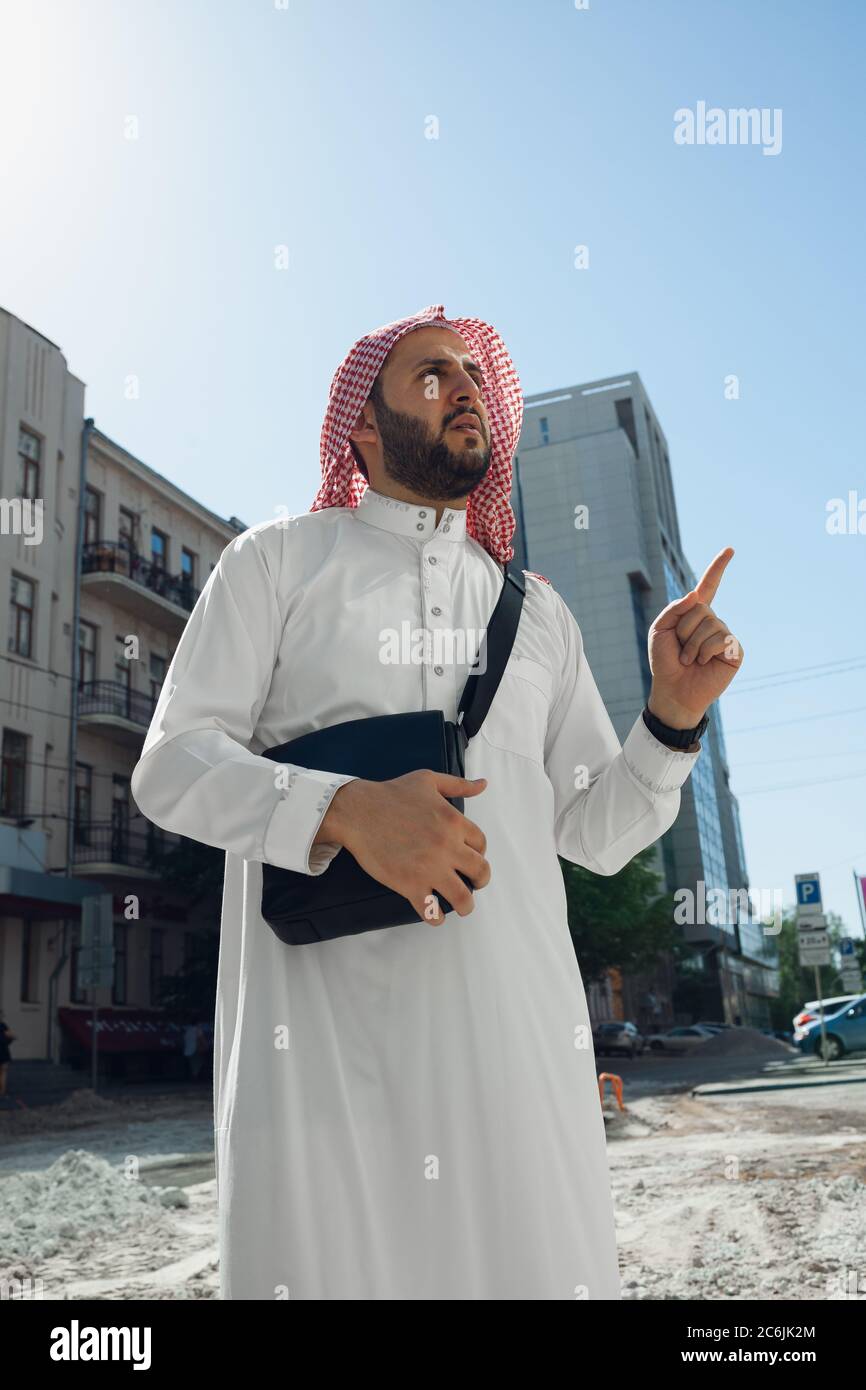 Rich arabian man's portrait during buying real estate, living house in ...