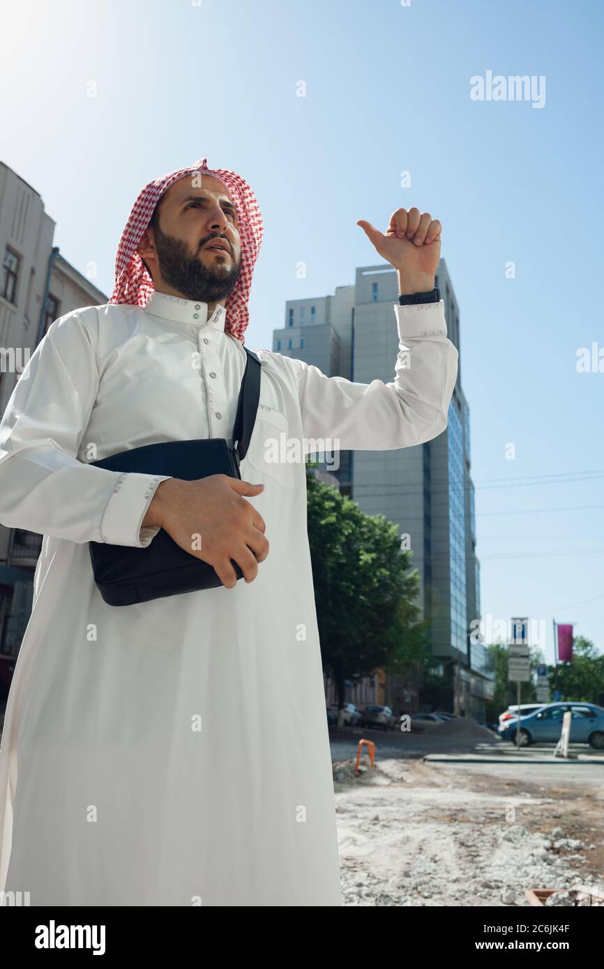 Rich arabian man's portrait during buying real estate, living house in ...