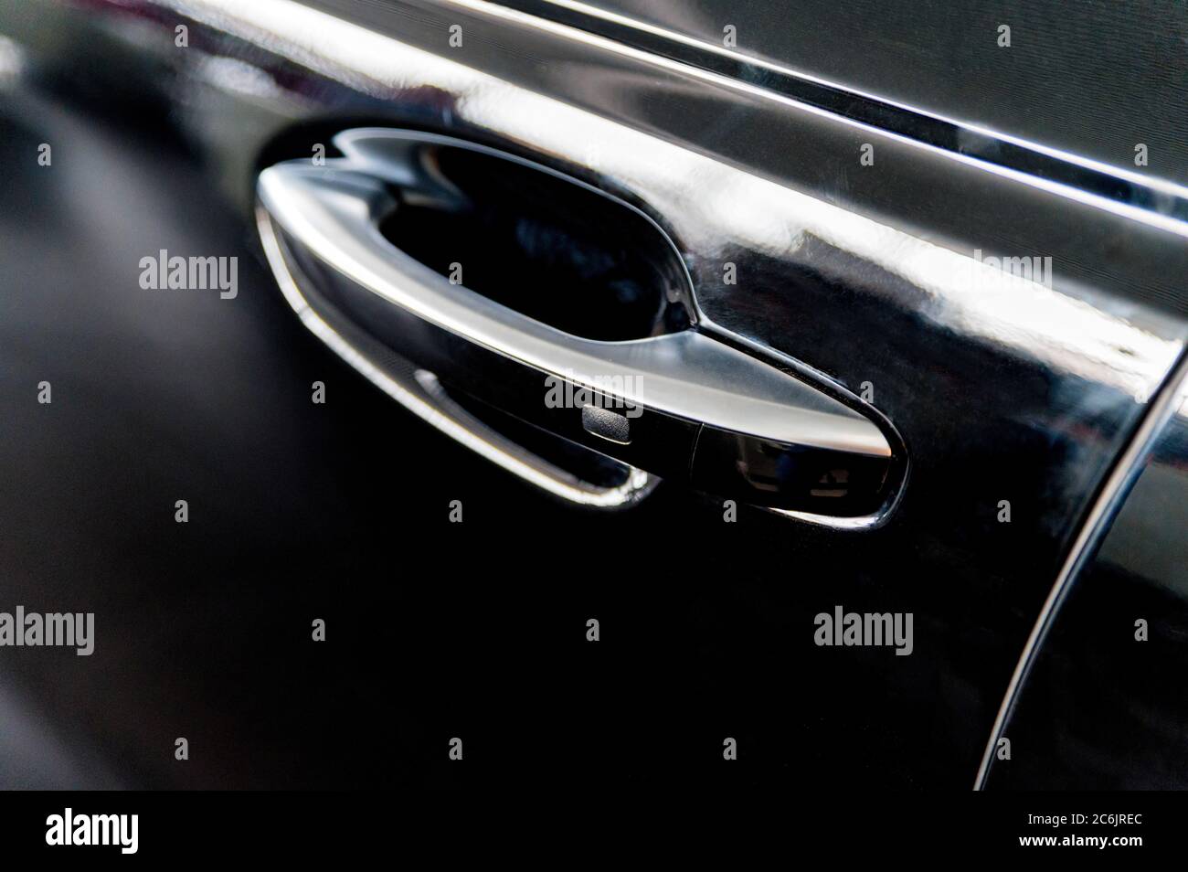 Close up of door handle of modern luxury car with in showroom Stock ...