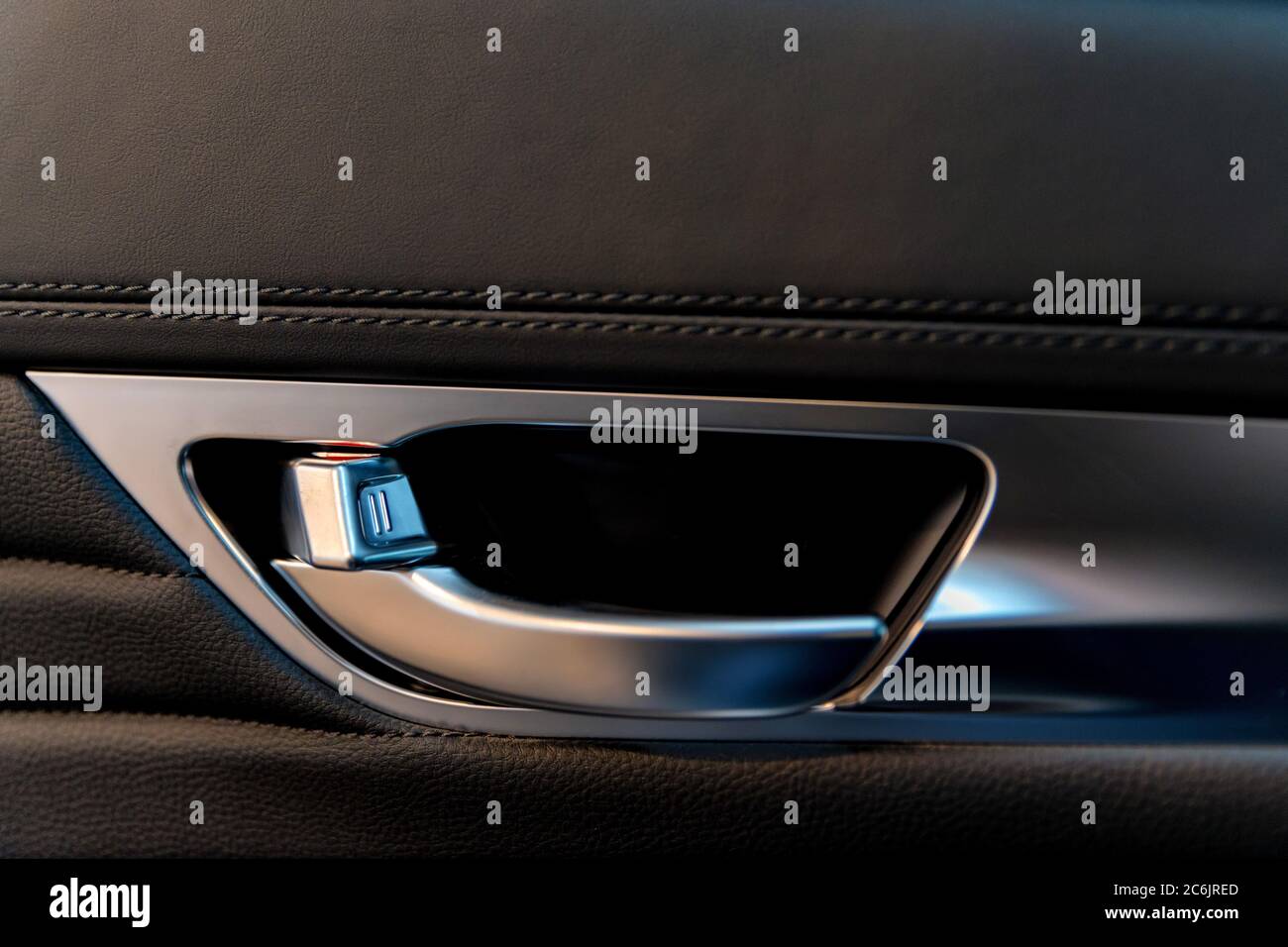 Close up of door handle of modern car placed inside Stock Photo - Alamy