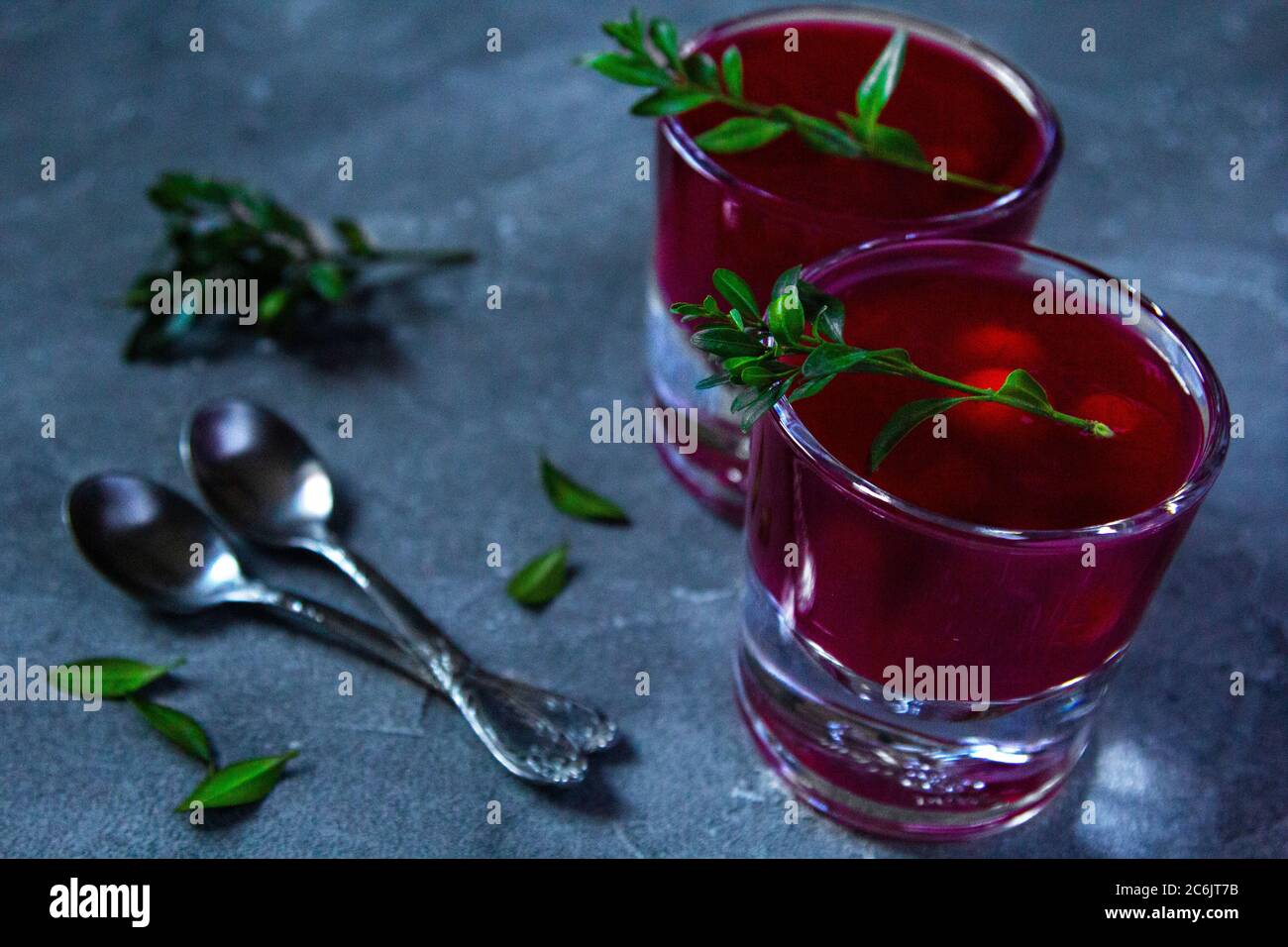 Russian traditional sweet drink kissel with cherries in two glasses on ...