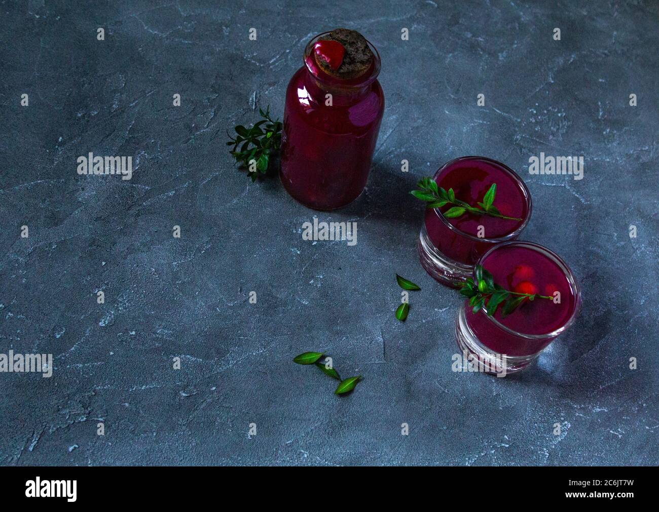 Russian traditional sweet drink kissel with cherries in two glasses and ...