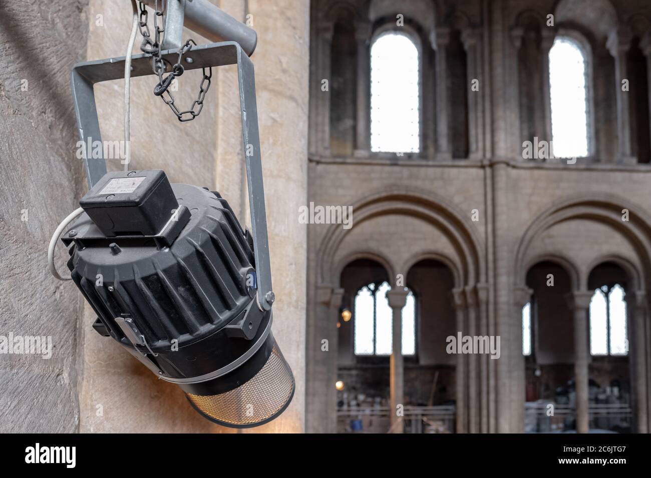 Detailed view of a trio of spotlights seen erected near the top of a ...