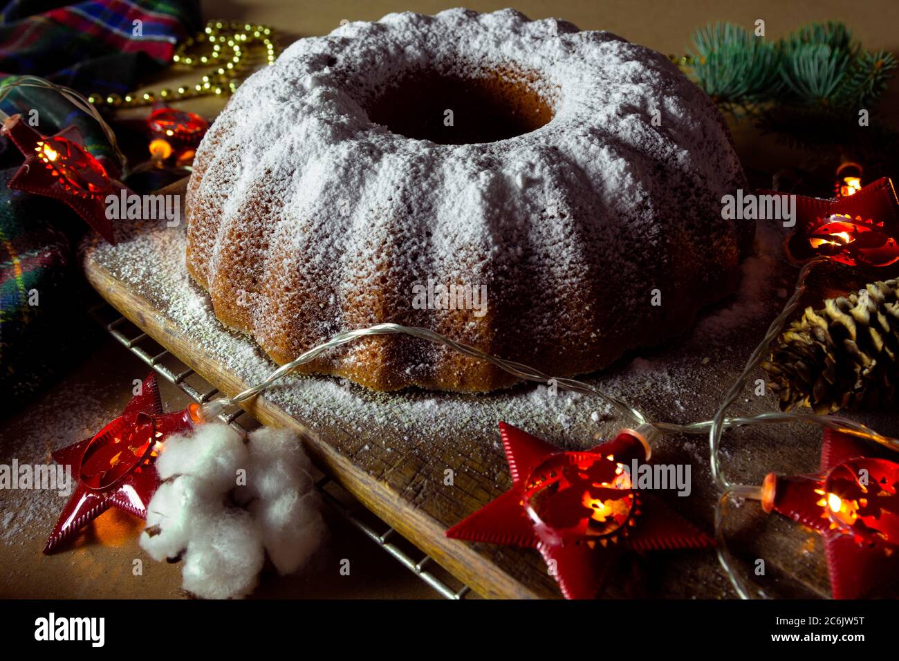 Homemade classic Bundt Christmas or New Year cake decorated with ...
