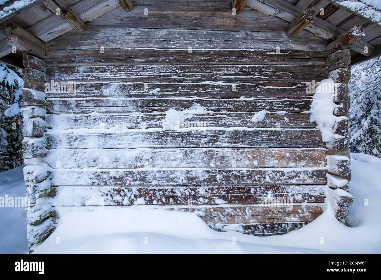 Snow covered wall of an old log cabin at Winter , Finland Stock Photo ...