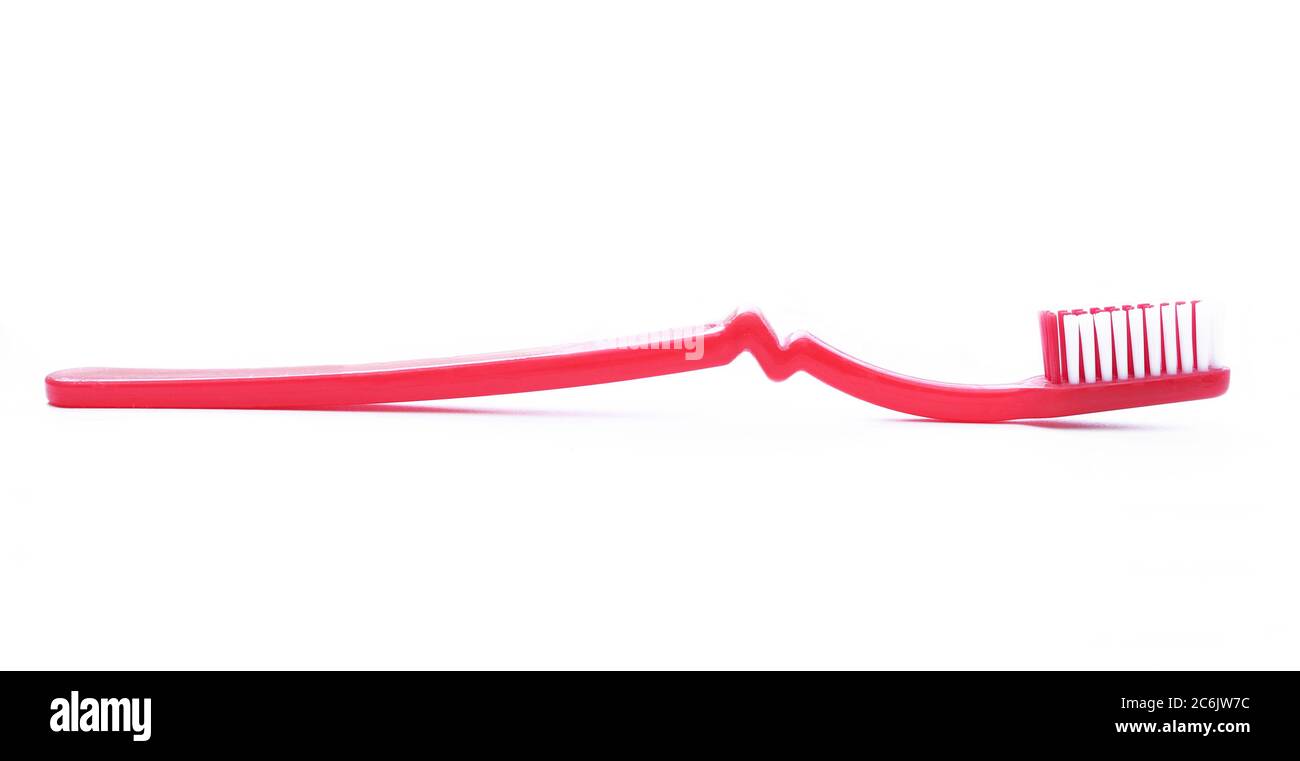 Red toothbrush isolated on white background Stock Photo - Alamy