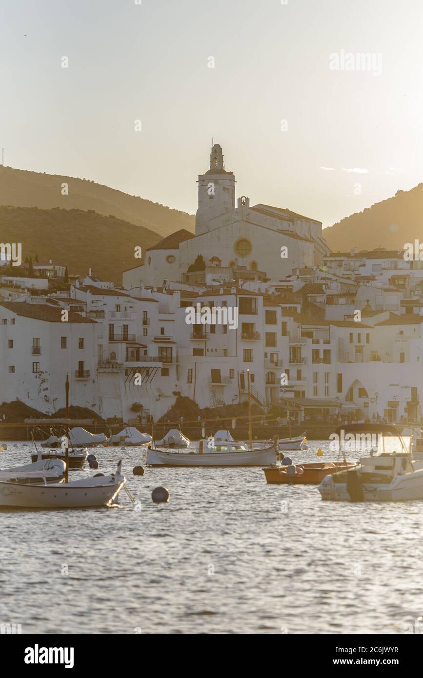 Boats in the beach and houses of the village of Cadaques, Spain Stock ...