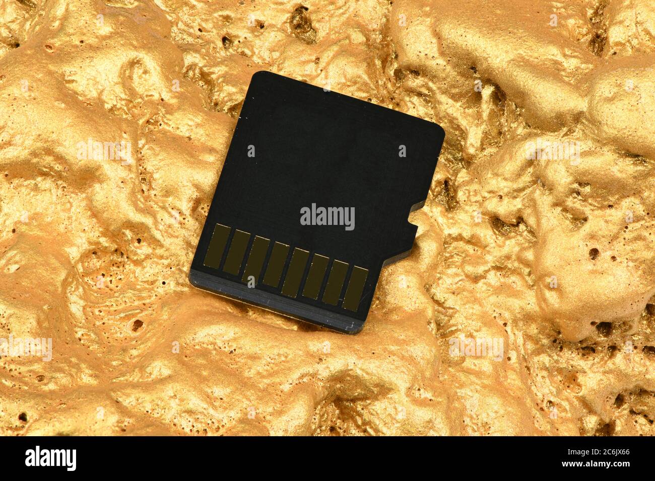 SD memory card isolated on gold background. Soft-focus Stock Photo - Alamy