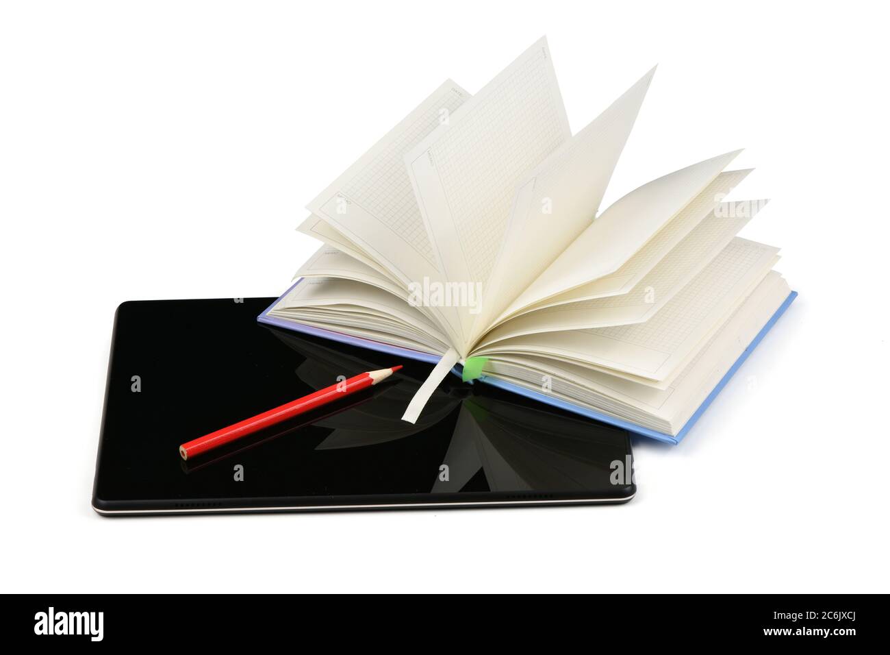 Opened notebook on tablet pc isolated on white background. High ...