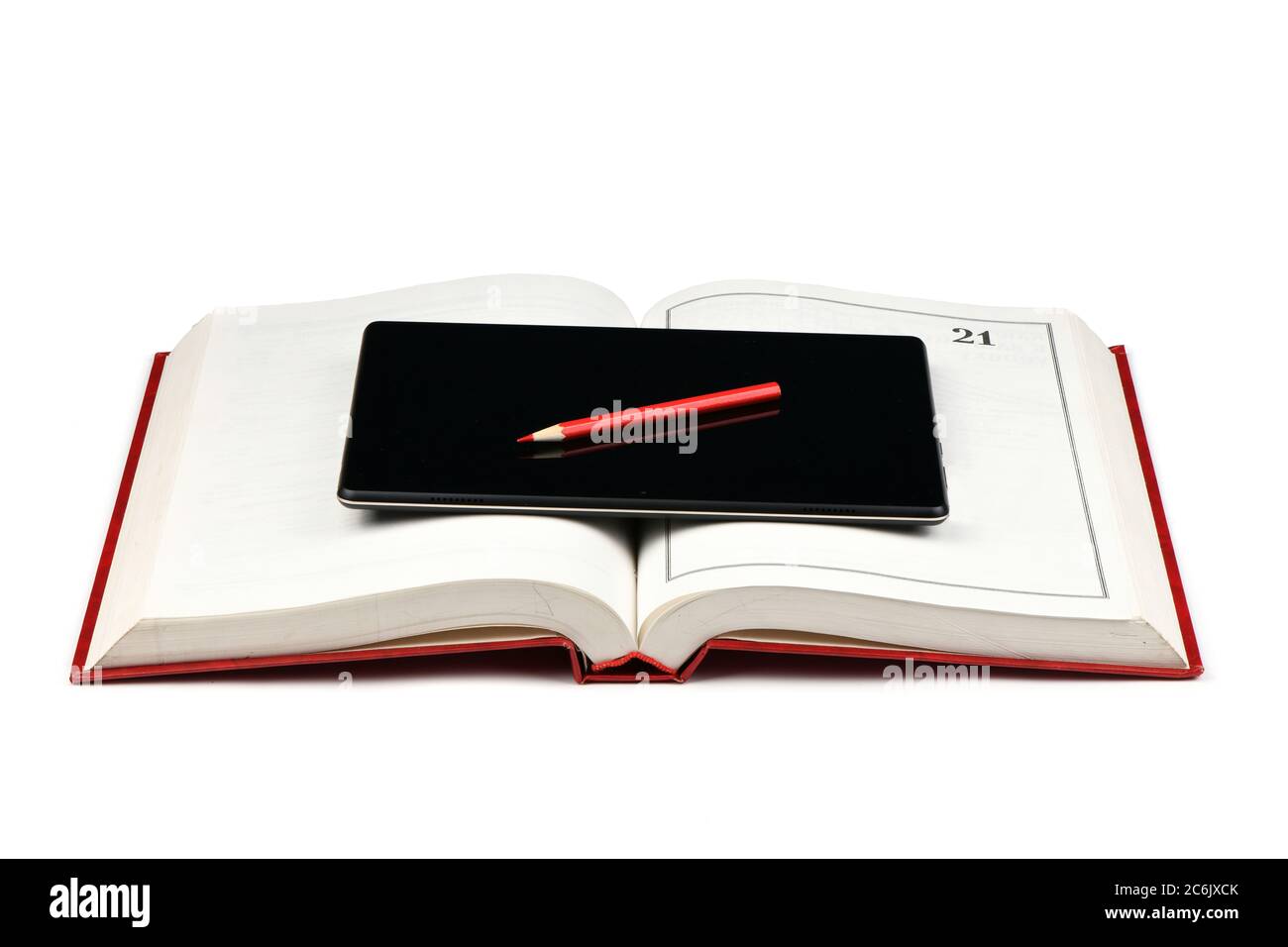 Tablet pc on opened book isolated on white background. High resolution ...