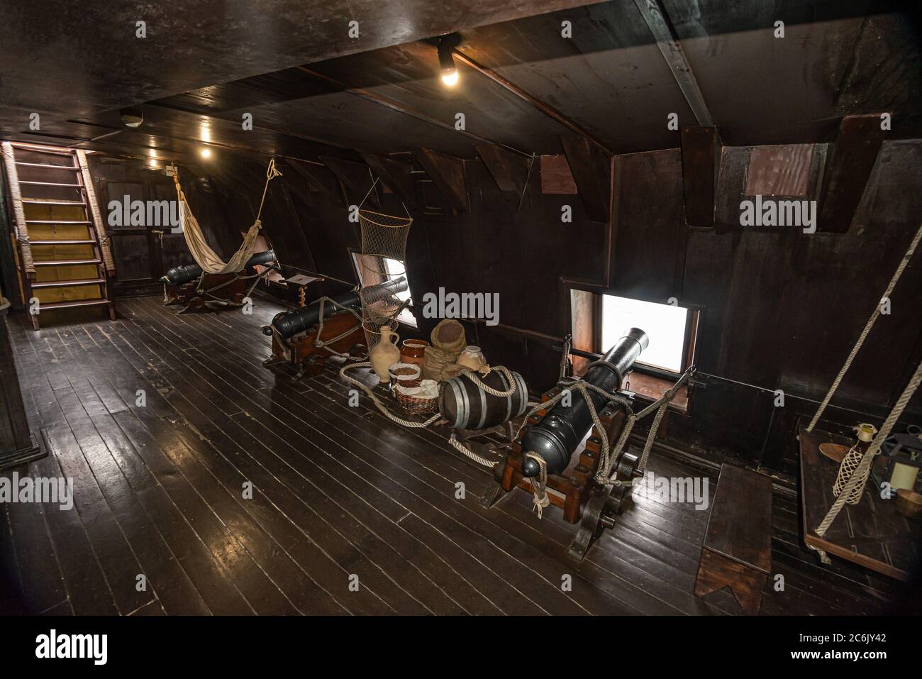 lower deck of a galleon with cannons and an hammock Stock Photo - Alamy