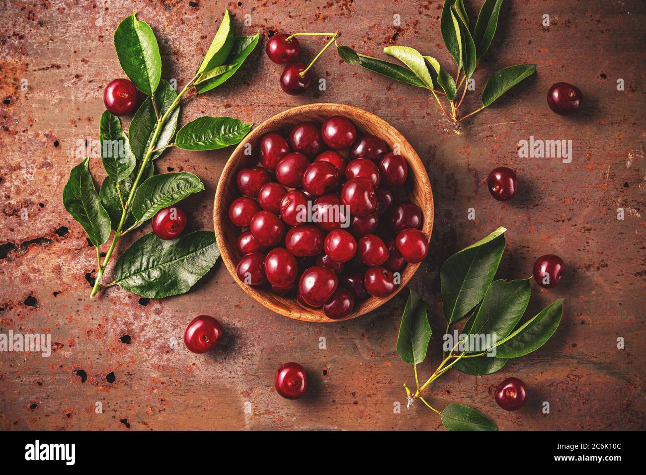 Still life of juicy cherry on rusty metal background. Flat lay. Top ...